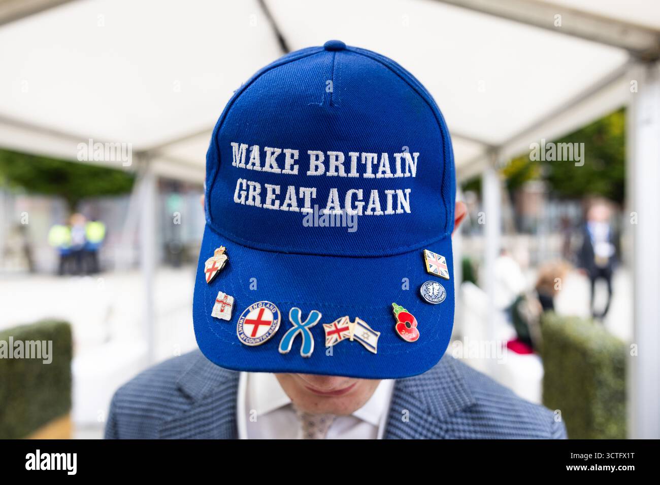 Manchester, UK. 06 OCT, 2025. Man wears "Make Britain Great Again" hat ...