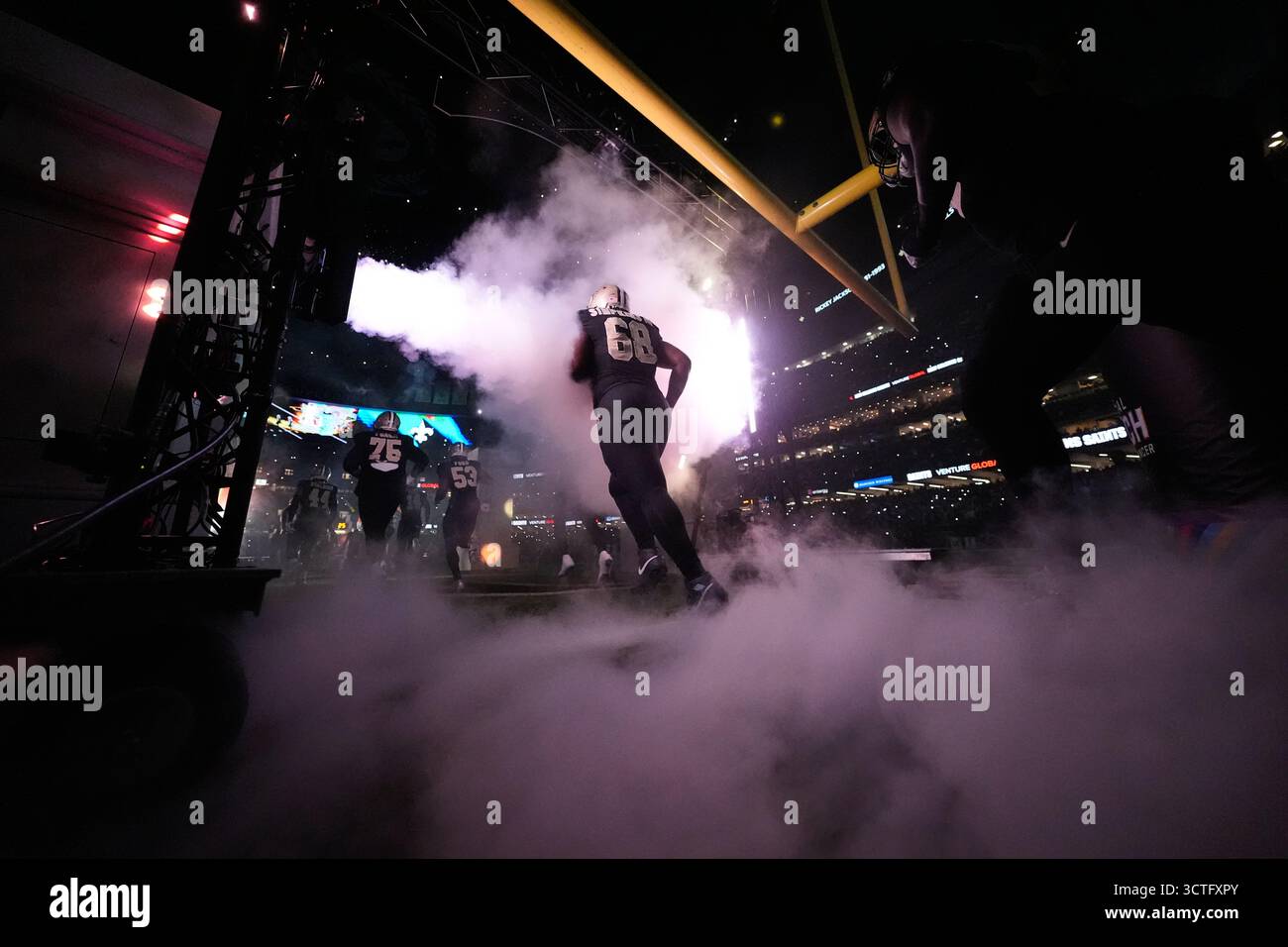 New Orleans Saints guard Torricelli Simpkins III runs onto the field ...