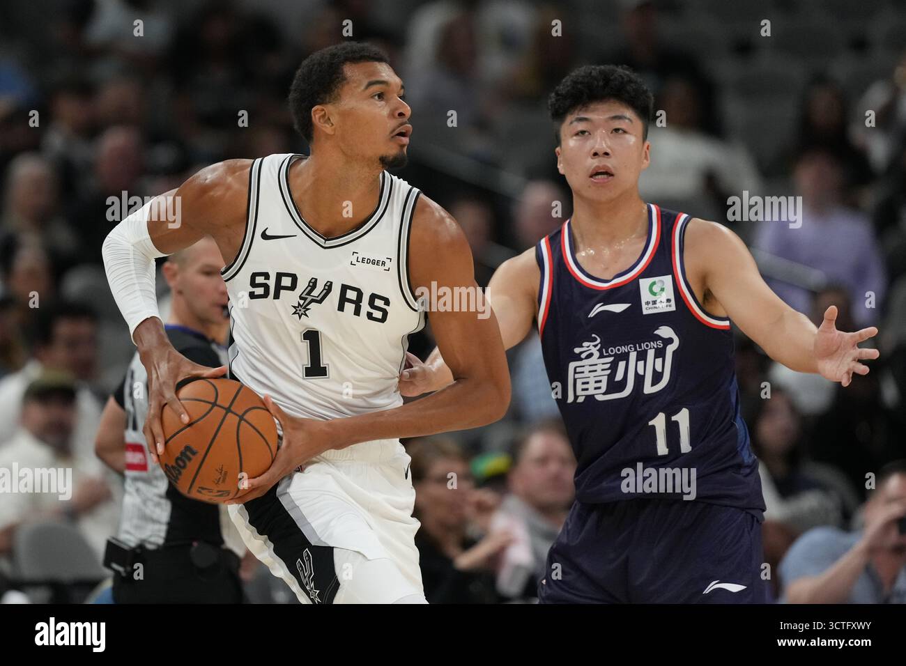 San Antonio Spurs forward/center Victor Wembanyama (1) is defended by ...