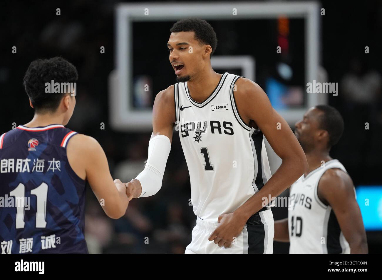San Antonio Spurs forward/center Victor Wembanyama (1) shakes hands ...