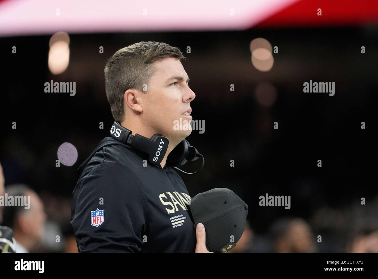 New Orleans Saints head coach Kellen Moore heads his hat to his heart ...