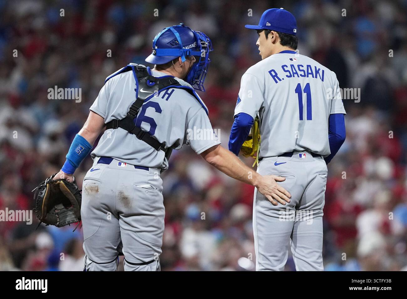 Los Angeles Dodgers catcher Will Smith, left, greets relief pitcher ...
