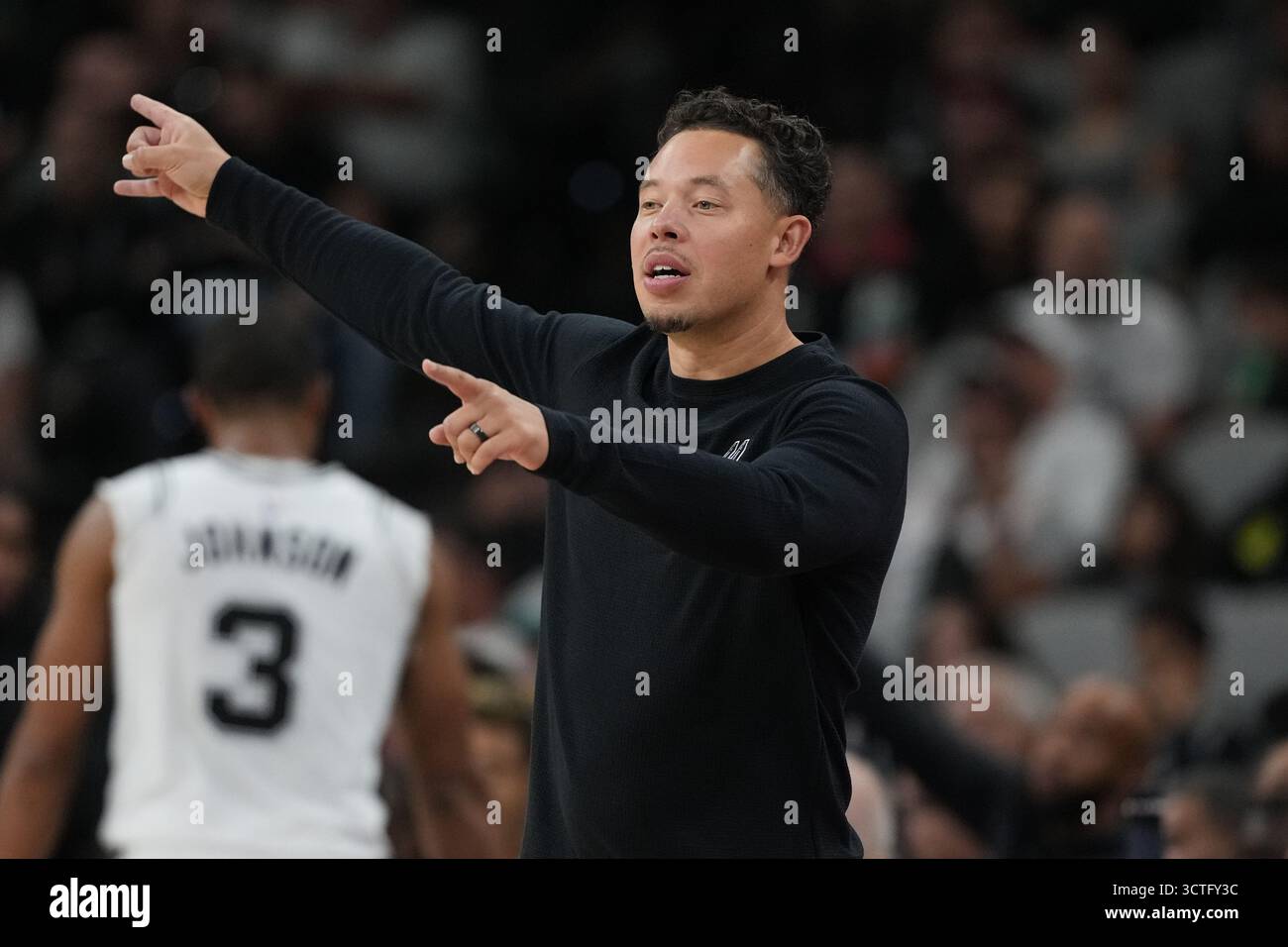 San Antonio Spurs Head Coach Mitch Johnson signals to his players ...