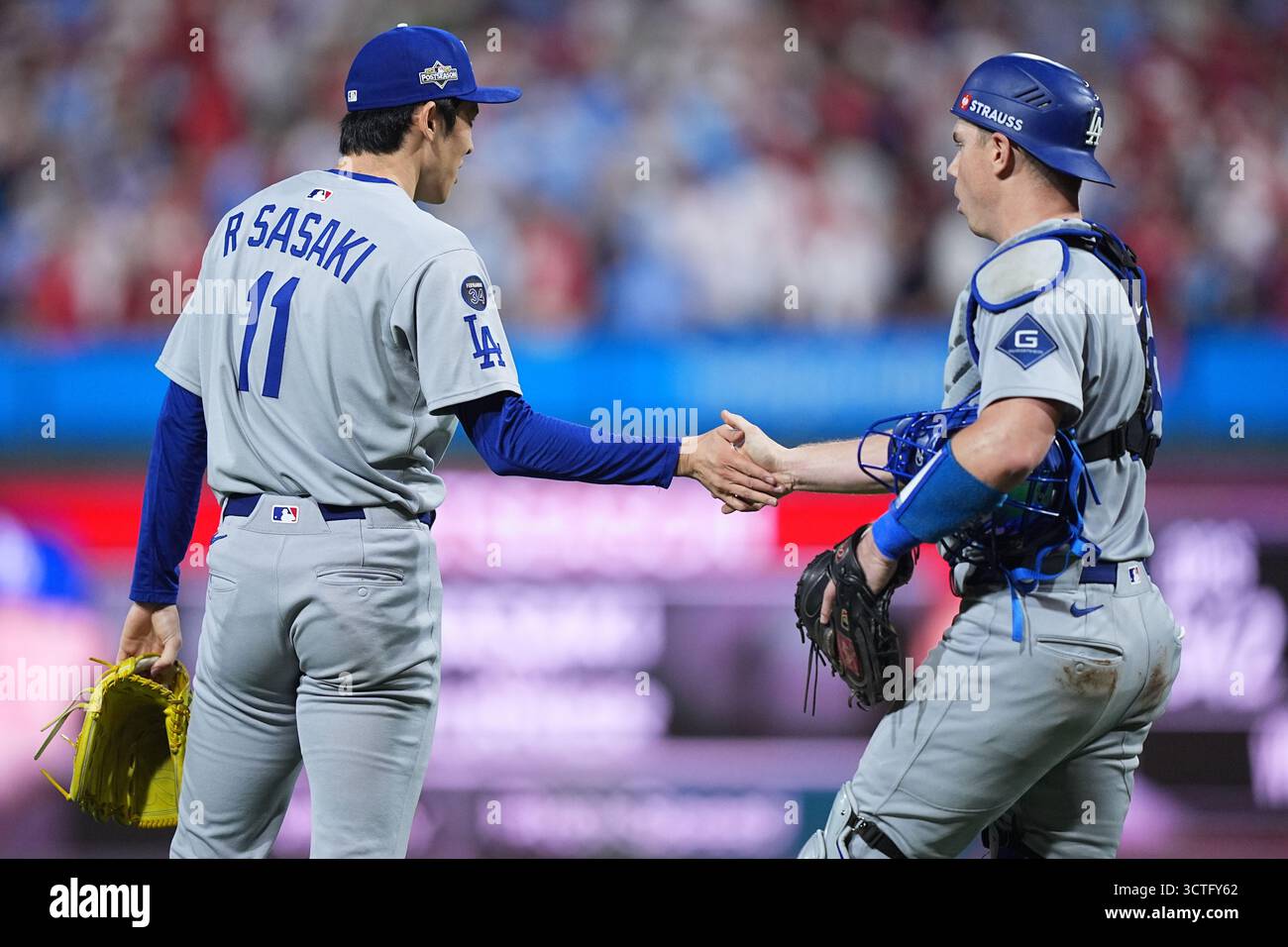 Los Angeles Dodgers relief pitcher Roki Sasaki, left, and catcher Will ...