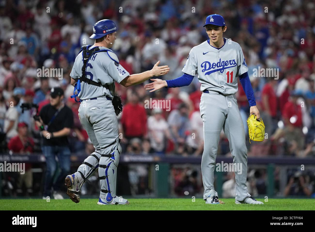 Los Angeles Dodgers relief pitcher Roki Sasaki, right, and catcher Will ...