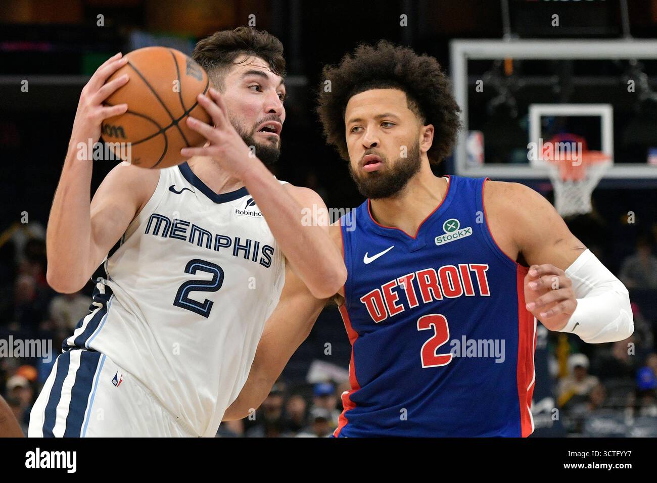 Memphis Grizzlies guard Ty Jerome, left, drives against Detroit Pistons ...