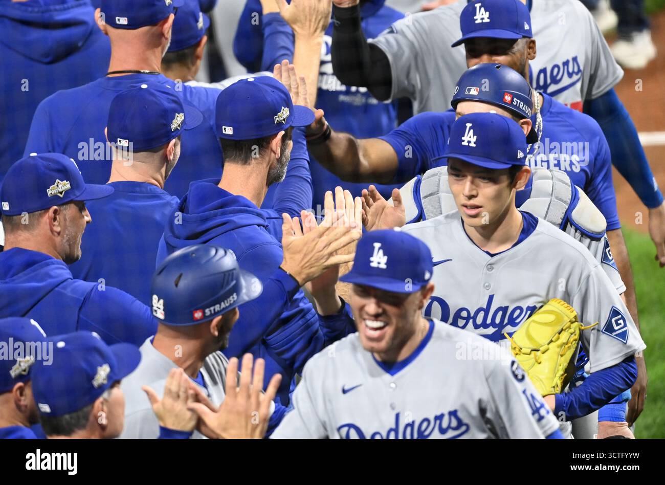 Los Angeles Dodgers pitcher Roki Sasaki and others celebrate after ...