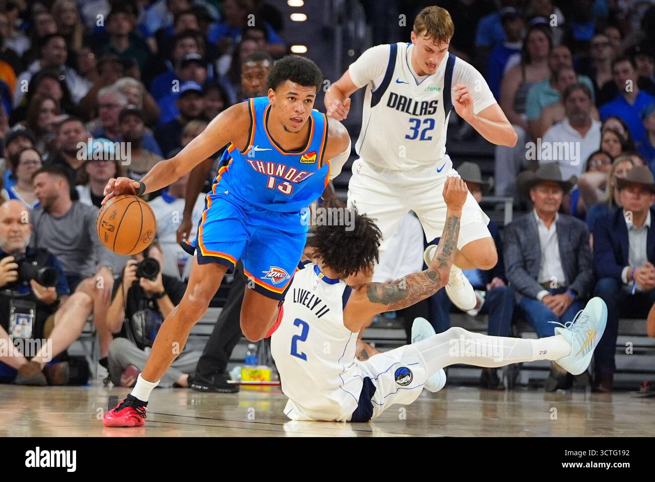 Oklahoma City Thunder forward Ousmane Dieng, left, comes up with the ball against Dallas ...