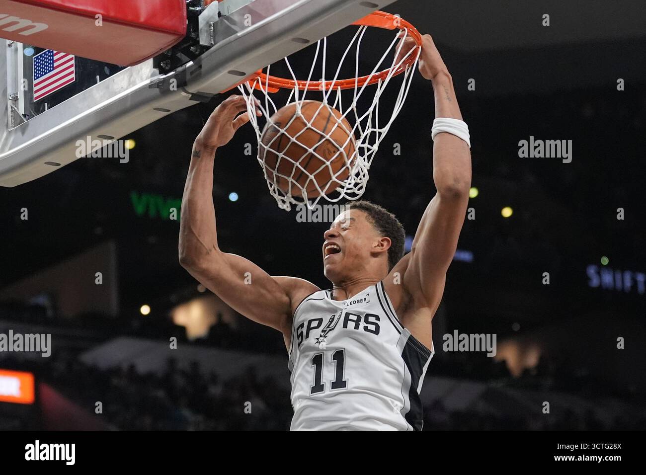San Antonio Spurs forward Carter Bryant (11) scores against the ...