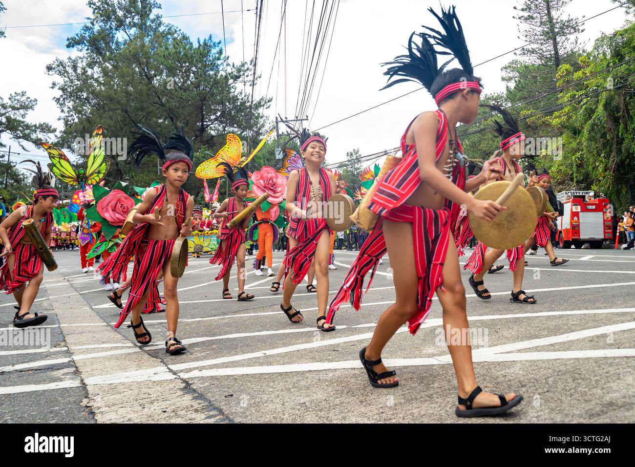Boys dressed in traditional tribal Filipino attire, participants at ...