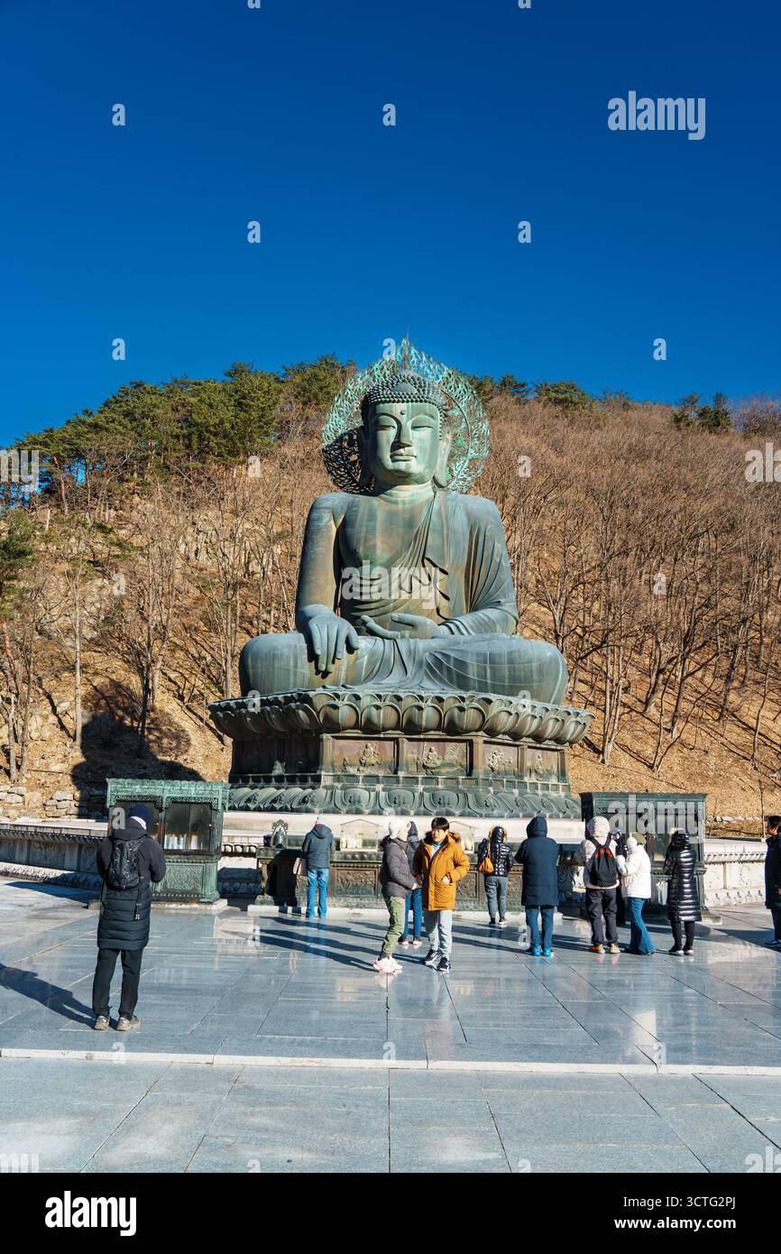 Sokcho, South Korea - Dec 27, 2024: Visitors admire the great bronze ...