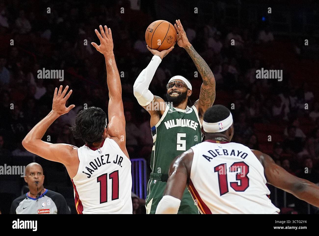 Milwaukee Bucks guard Gary Trent Jr. (5) jumps to shoot over Miami Heat ...