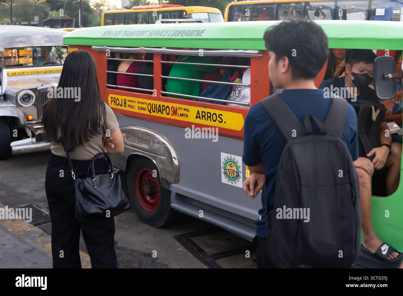 Students wait to board a traditional Philippine jeepney, popular ...