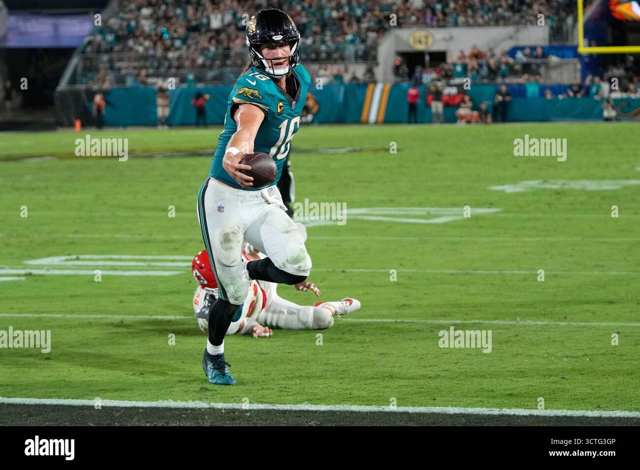 Jacksonville Jaguars quarterback Trevor Lawrence (16) gets past Kansas ...