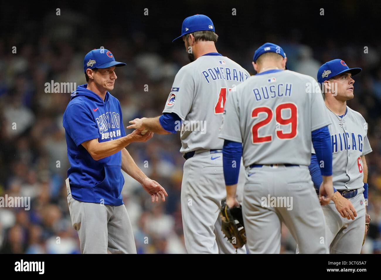 Chicago Cubs relief pitcher Drew Pomeranz (45) hands the game ball to ...