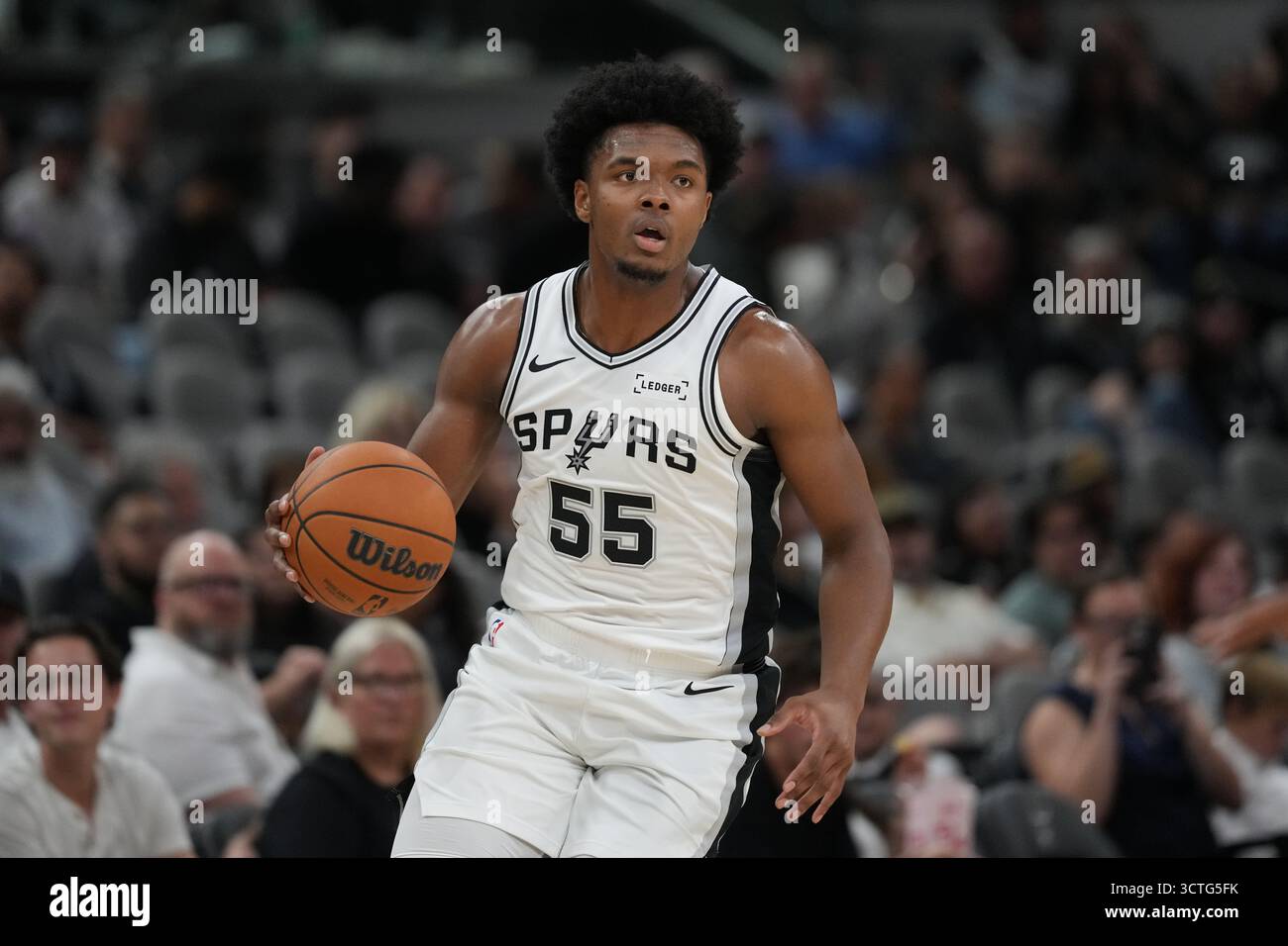 San Antonio Spurs forward Harrison Ingram (55) takes the ball up court ...