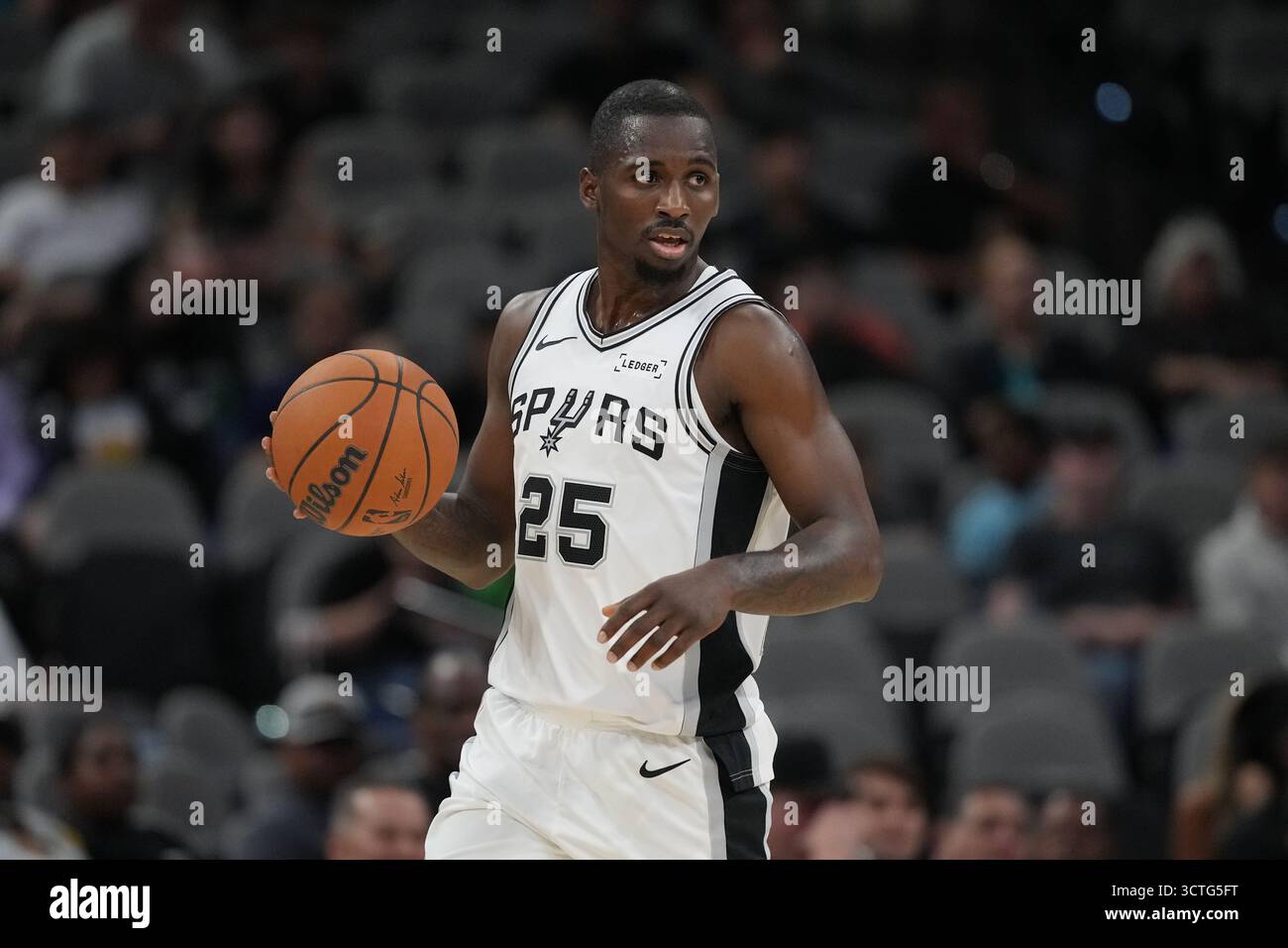 San Antonio Spurs forward David Jones Garcia (25) takes the ball up ...
