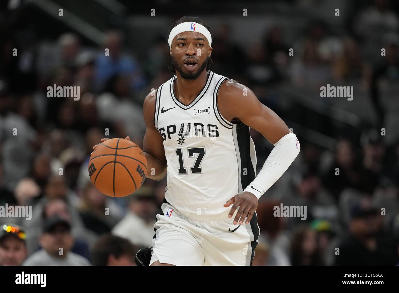 San Antonio Spurs guard Stanley Umude (17) takes the ball up court ...
