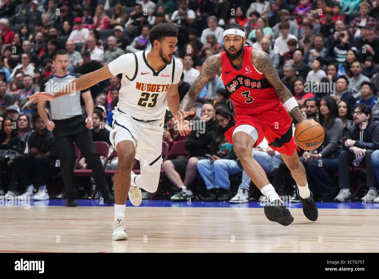 Toronto Raptors' Brandon Ingram (3) drives past Denver Nuggets' Cameron ...