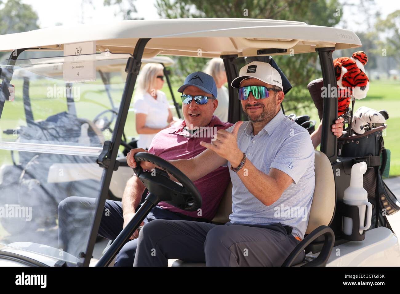 Jonathan Treisman, left, and Zach Goldsmith attend the 25th Emmys Golf ...