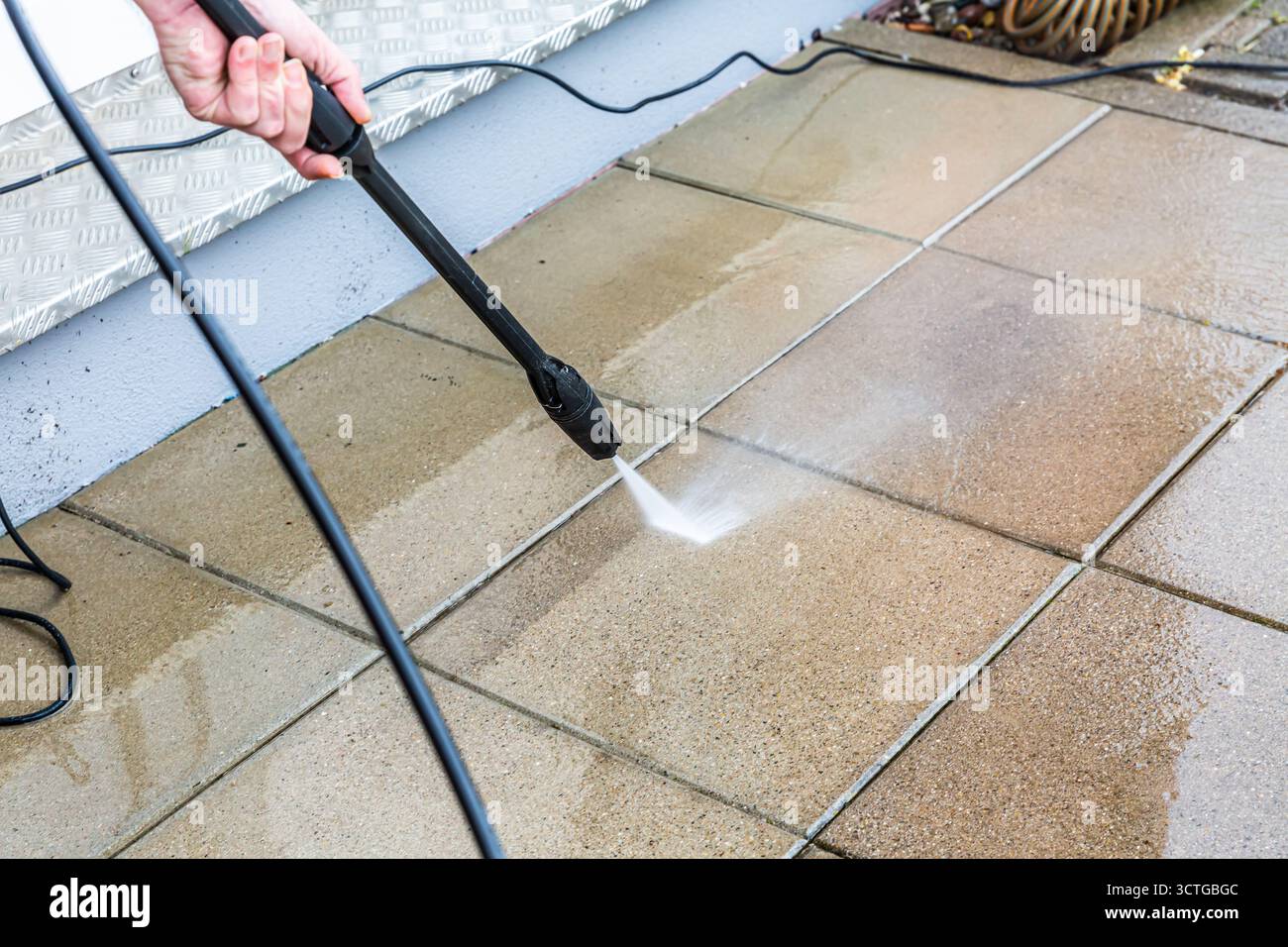 Outdoor floor cleaning with high pressure water jet Stock Photo - Alamy