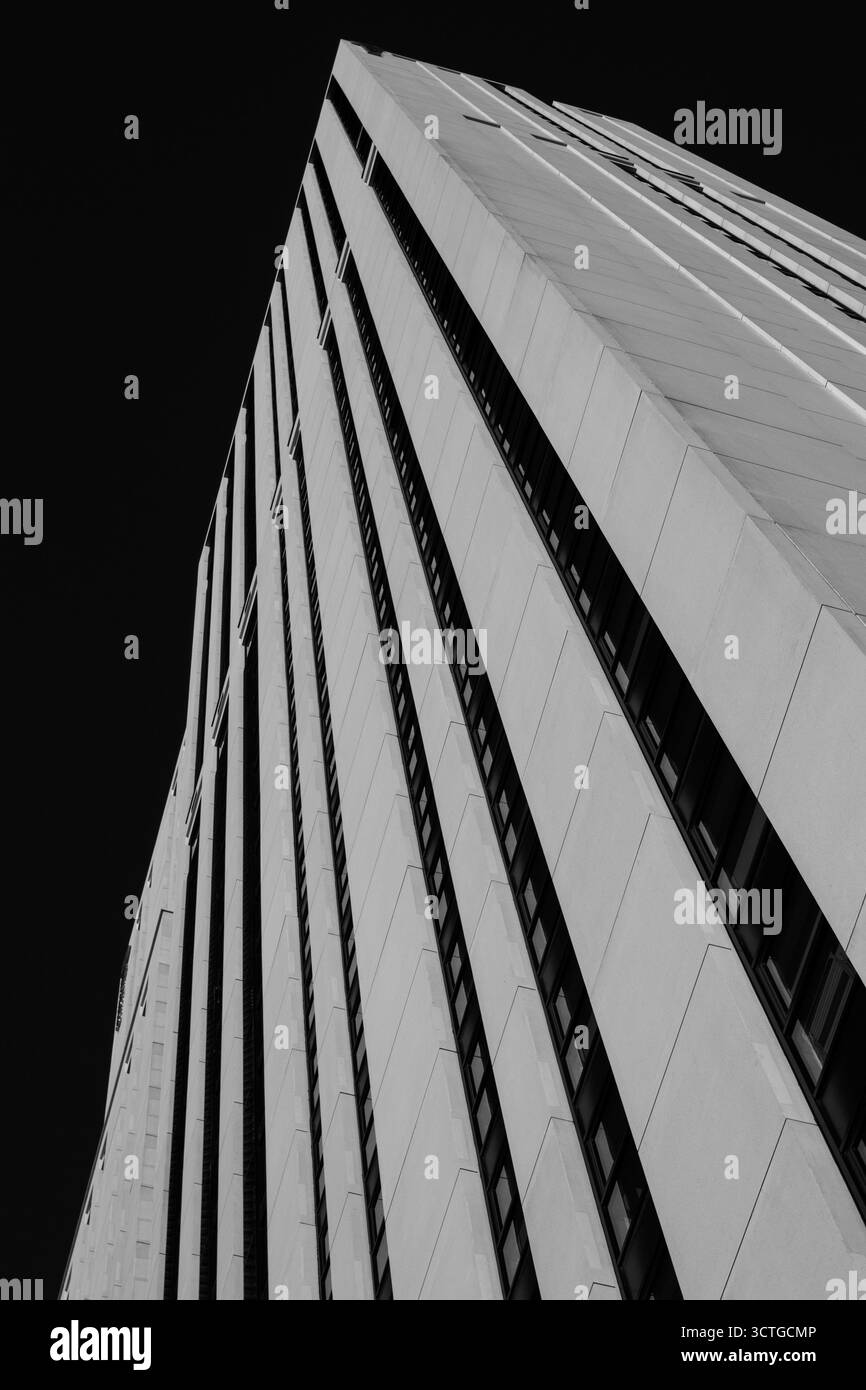 Modern high-rise office building viewed from below in black and white ...