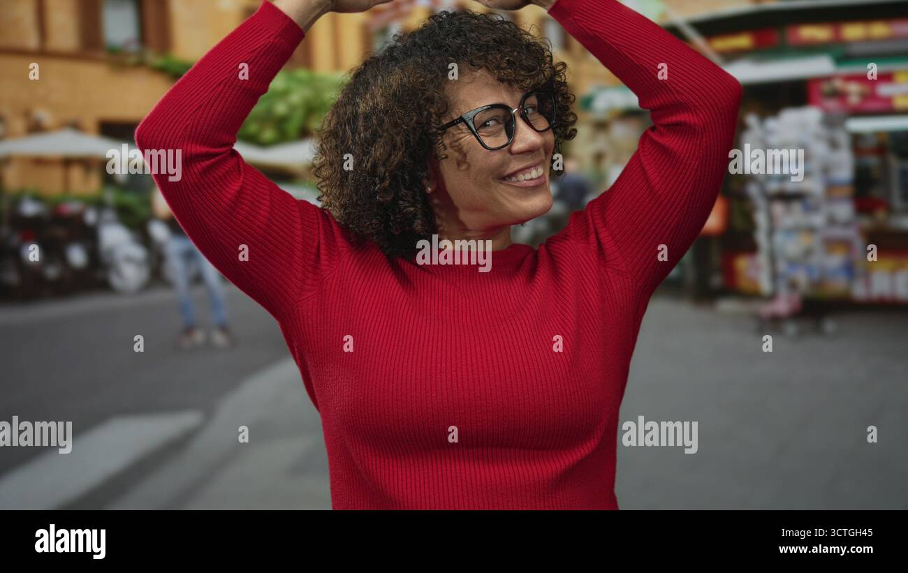 Hispanic woman raises arms overhead hi-res stock photography and images ...
