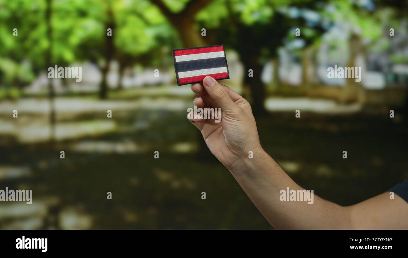 Man holding thai flag patch hi-res stock photography and images - Alamy