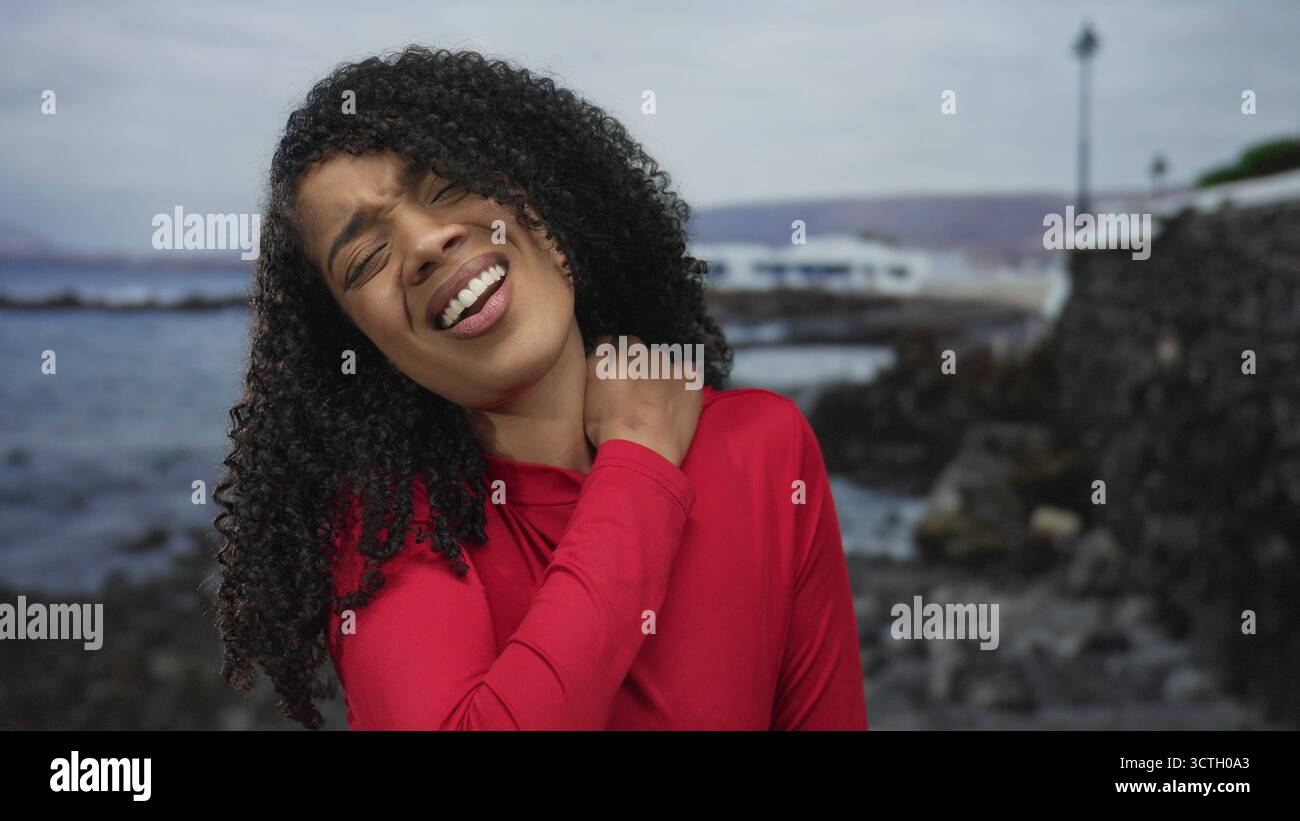 Woman clutching neck tilting head hi-res stock photography and images ...