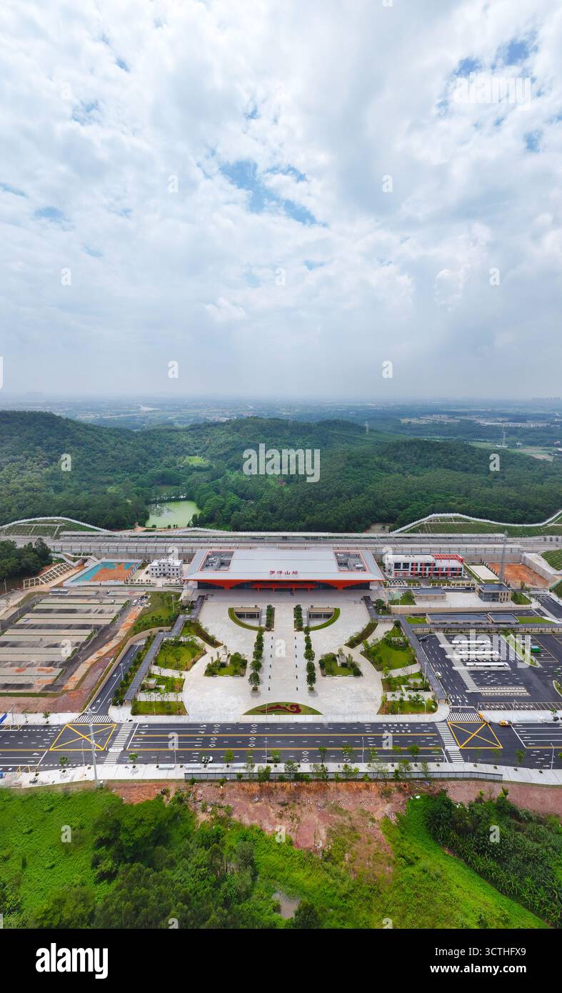 Aerial photography of Luofushan Station on Guangshan High speed Railway ...