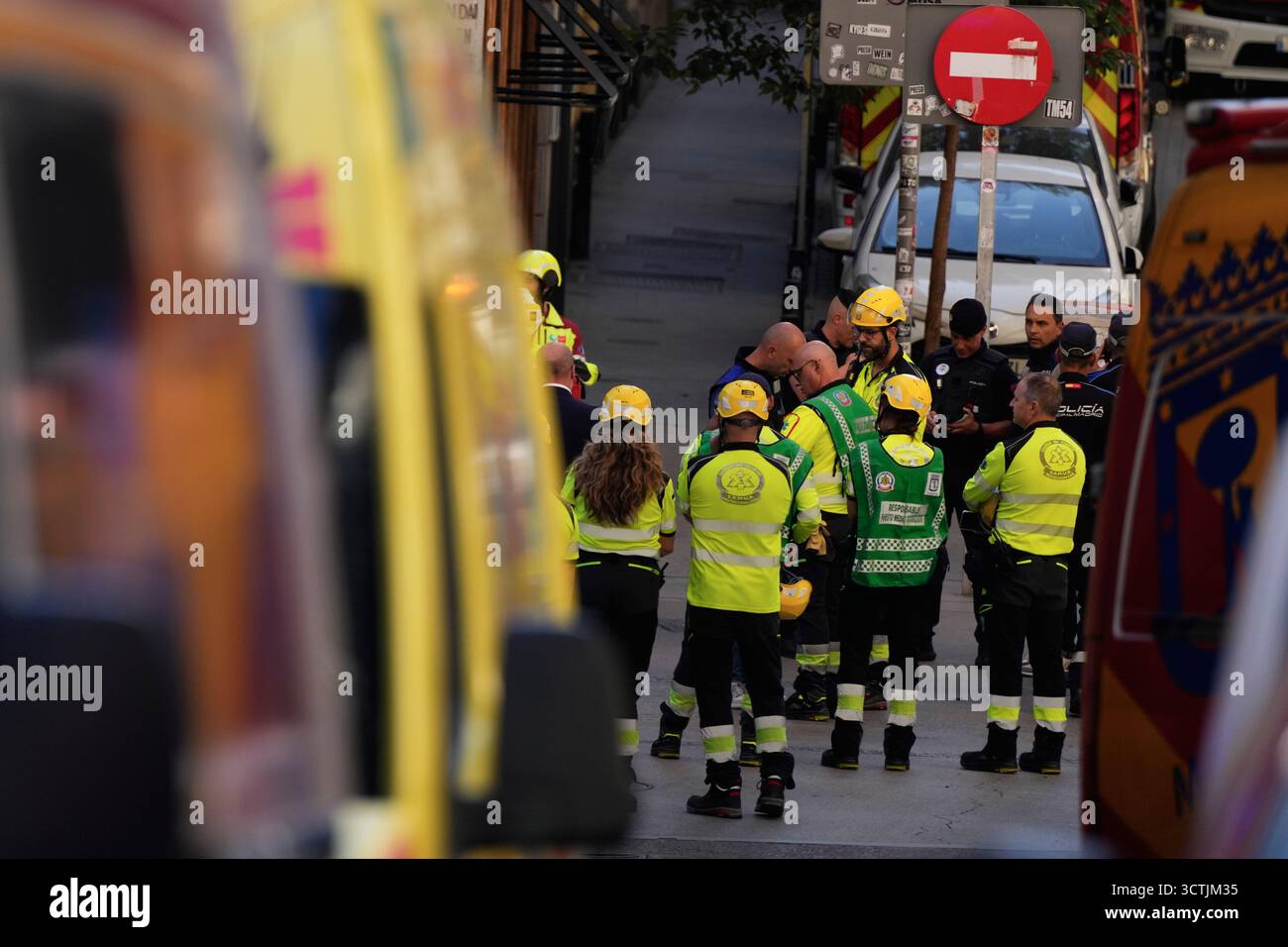 Emergency personnel respond to the scene of a building collapse in ...