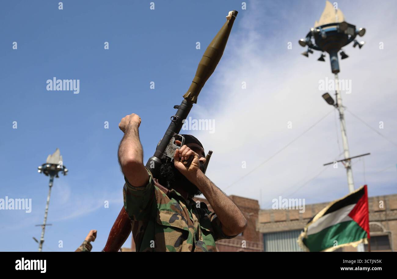 YEMEN HAMAS ISRAEL WAR- A Houthi fighter holds up a rocket launcher and ...