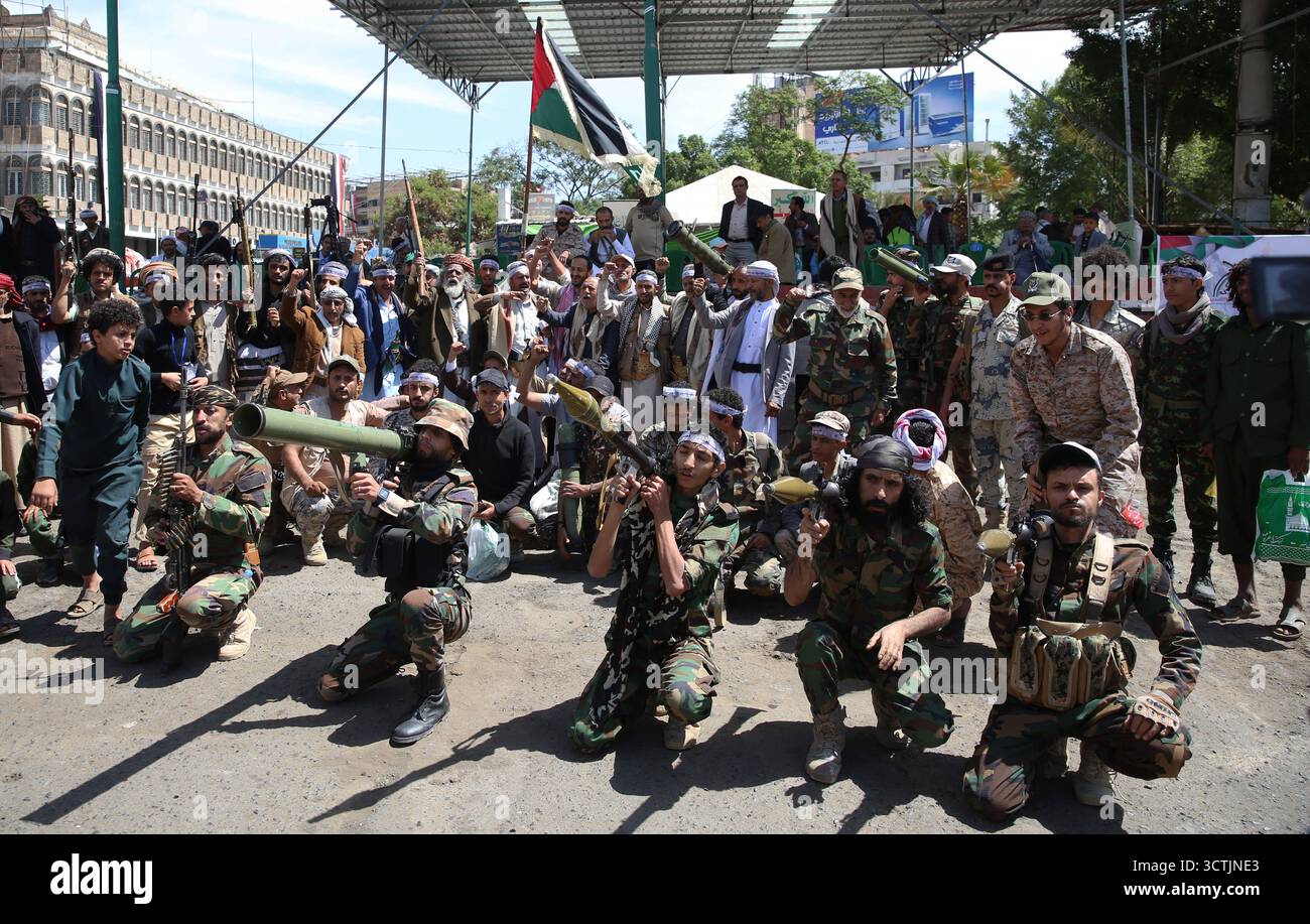 YEMEN HAMAS ISRAEL WAR- Houthi fighters hold up guns and rocket ...