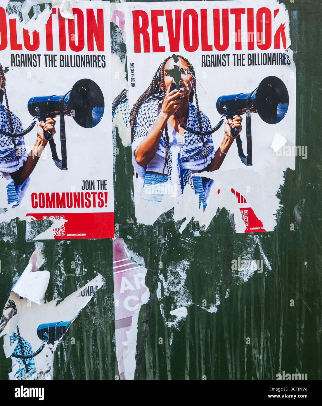 Torn posters reading "Revolution Against the Billionaires – Join the ...