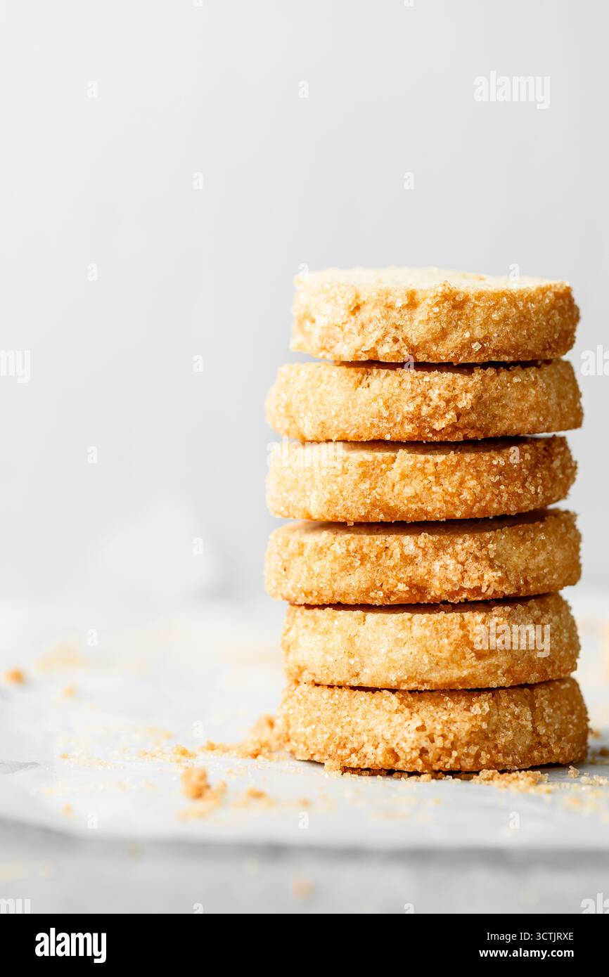 Stack of golden homemade shortbread biscuits photographed in natural ...