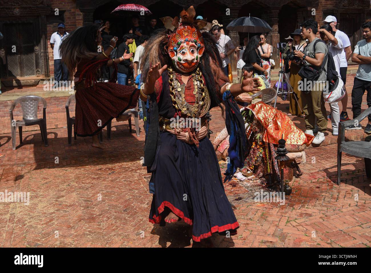 Lalitpur, Nepal. 7 October 2025. Masked dancers portraying deities of ...