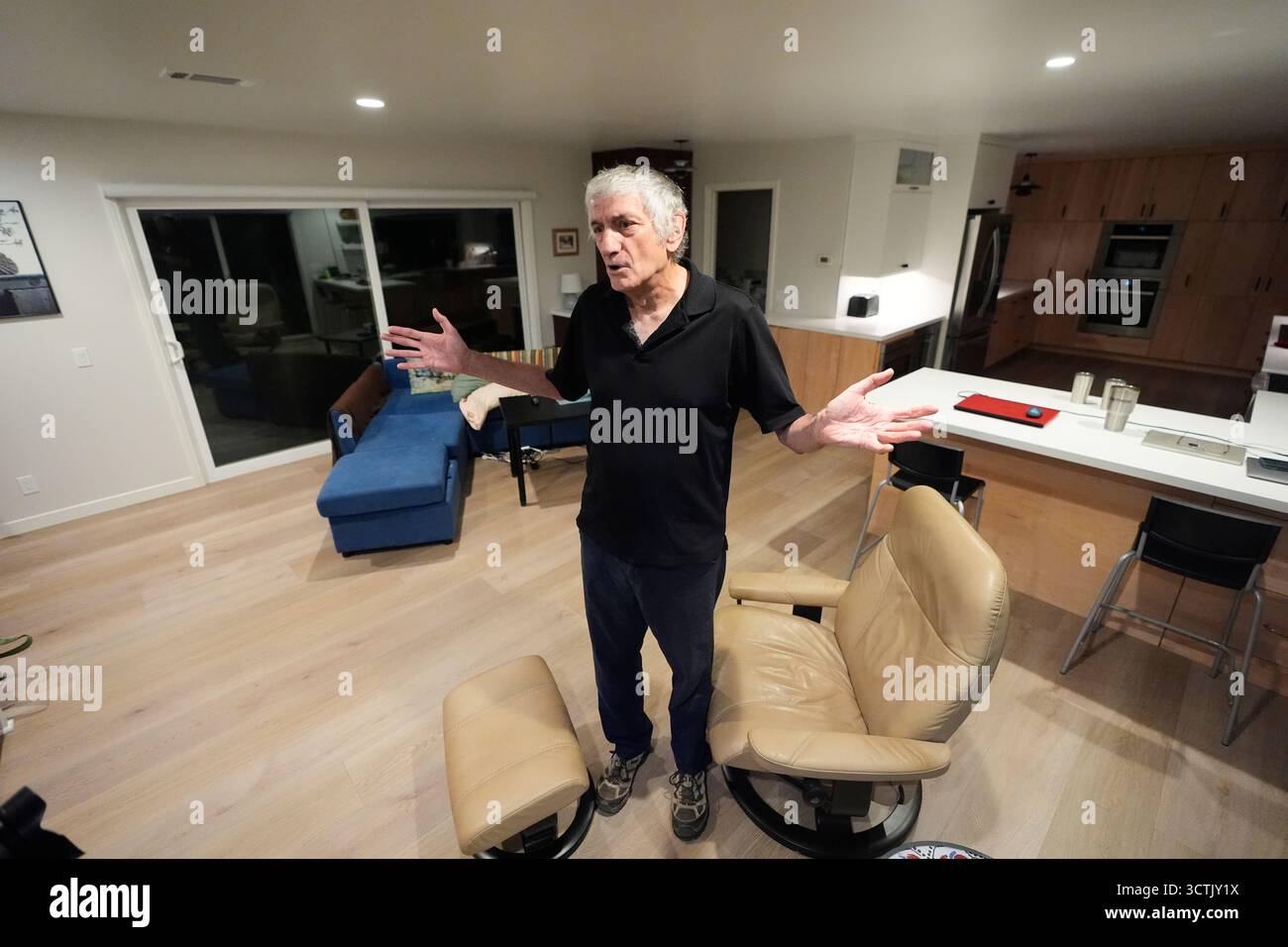 John Martinis stands in his living room after winning the Nobel Prize ...