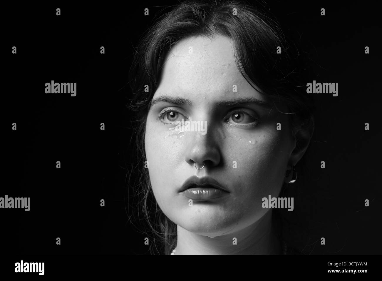 Sad woman crying on dark background. Black and white effect Stock Photo ...