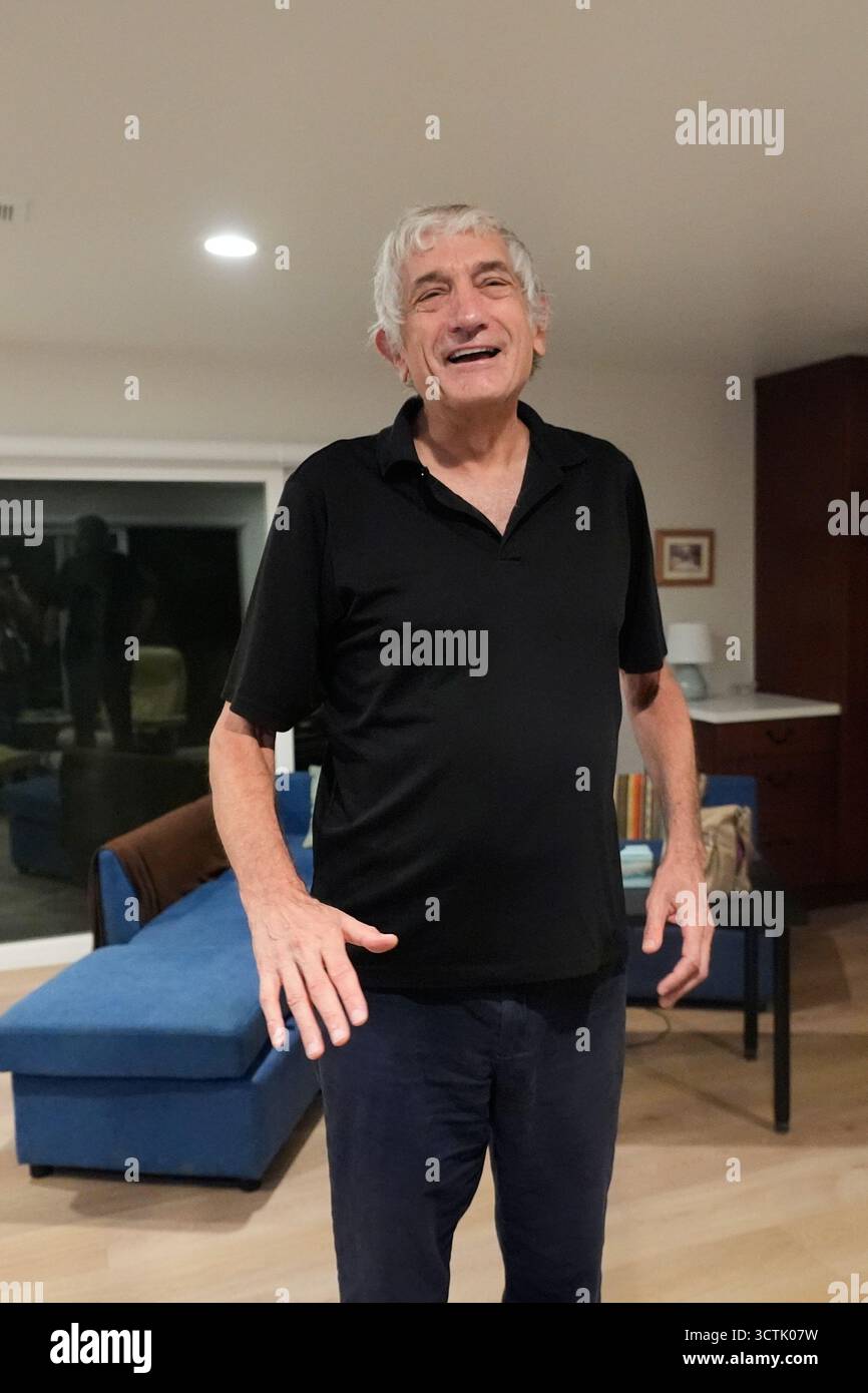 John Martinis smiles in his living room after winning the Nobel Prize ...