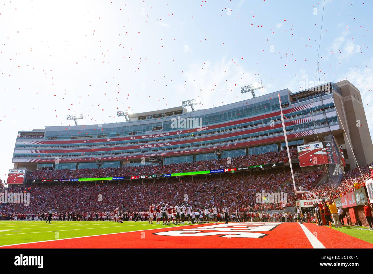 Fans release red balloons after a Nebraska touchdown against Michigan ...