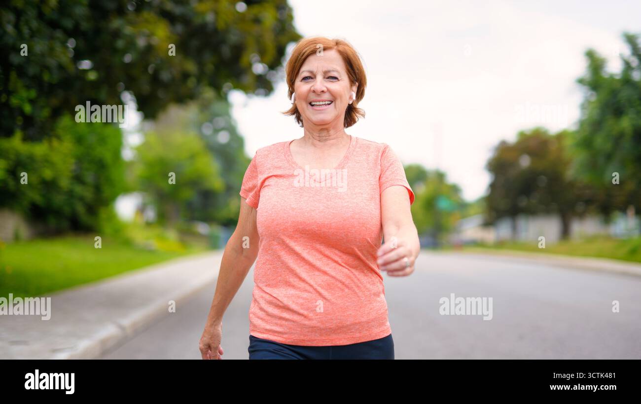 Elderly woman walking fast park hi-res stock photography and images - Alamy