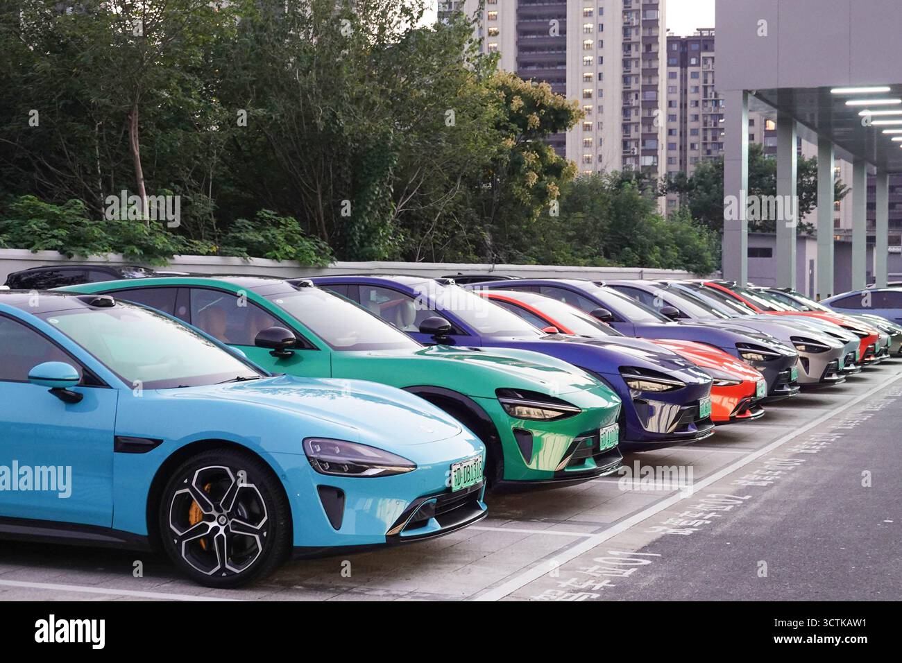 Changzhou, Jiangsu, China. 6th Oct, 2025. A neat row of colorful Xiaomi ...