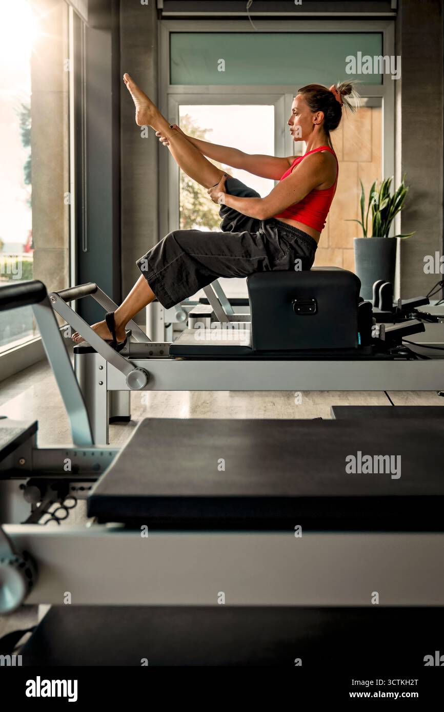 Woman performs challenging core hi-res stock photography and images - Alamy