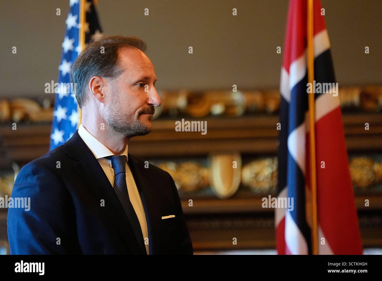 Crown Prince Haakon of Norway listens to Minnesota Governor Tim Walz ...