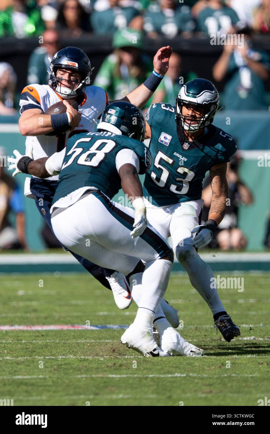 Denver Broncos quarterback Bo Nix, left, runs with the ball against ...