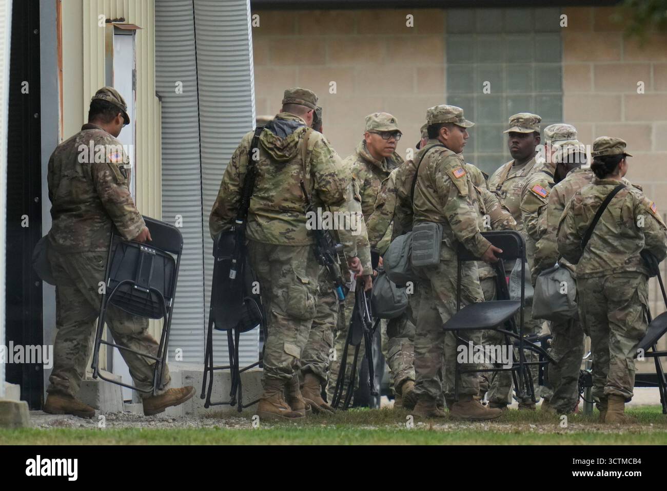 Military personnel in uniform, with the Texas National Guard patch on ...