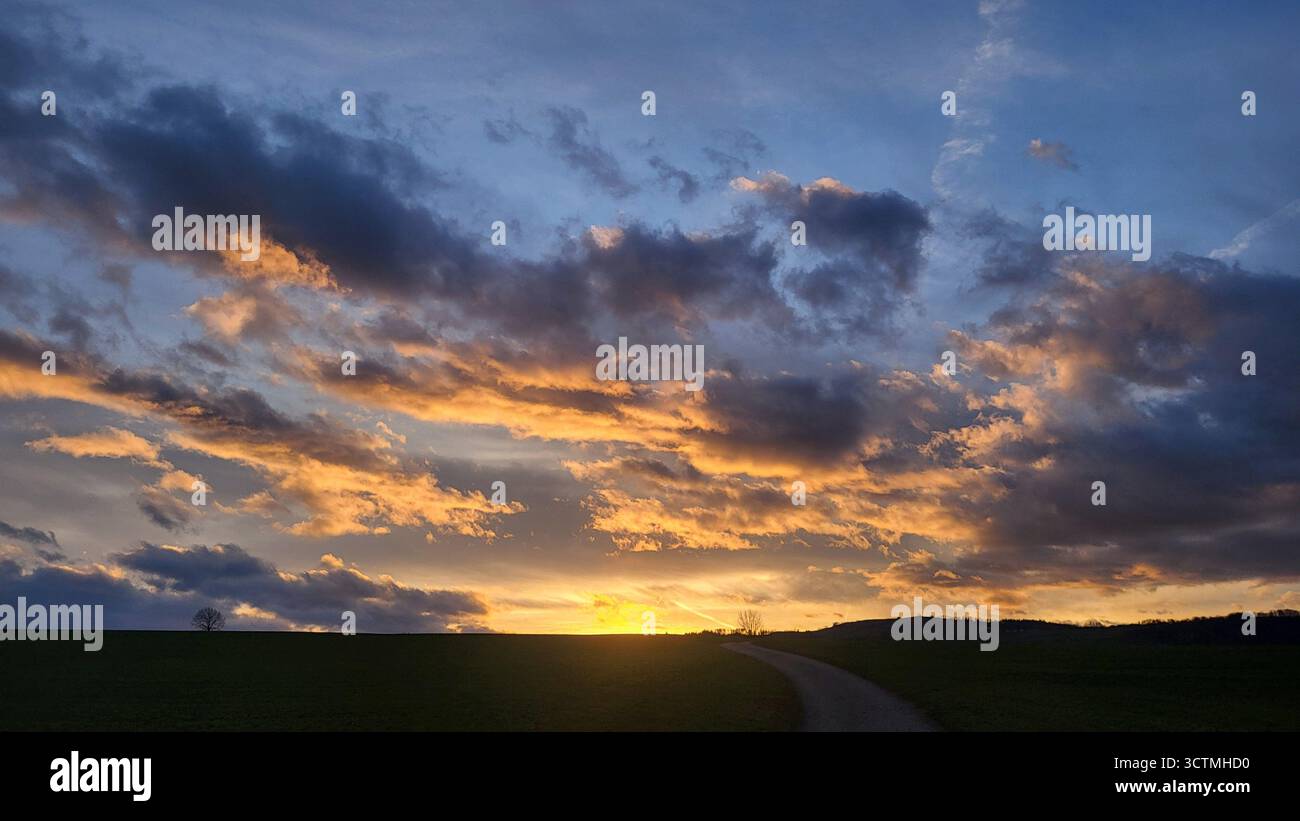 Beautiful evening atmosphere in winter with sunset, dramatic colorful ...
