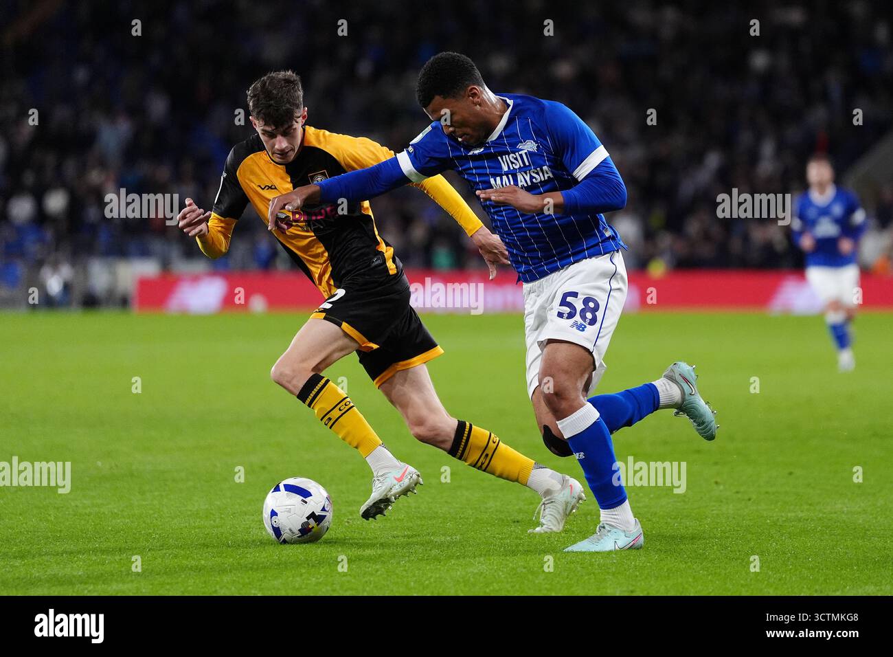 Cardiff City's T-Jay Parfitt (right) and Newport County's Joe Thomas ...