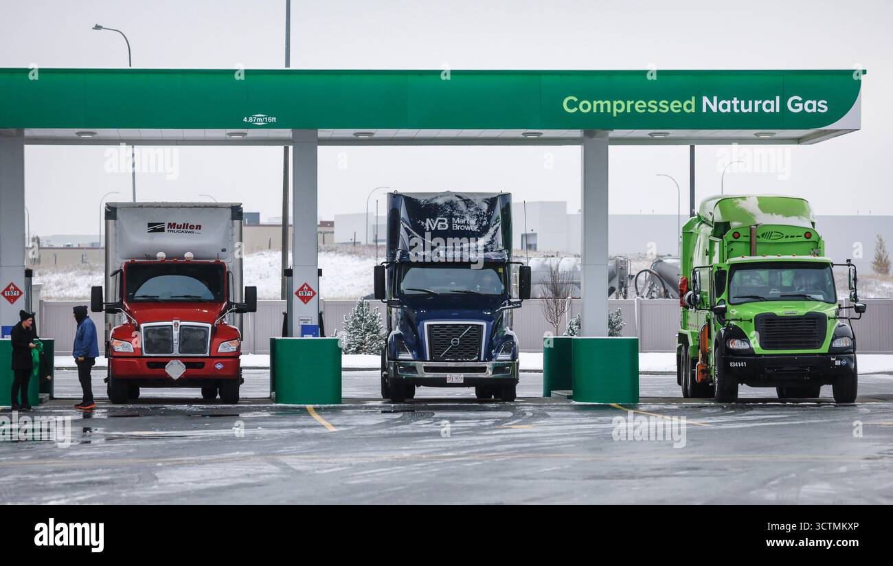 Commercial vehicle drivers wait to refuel at a compressed natural gas ...