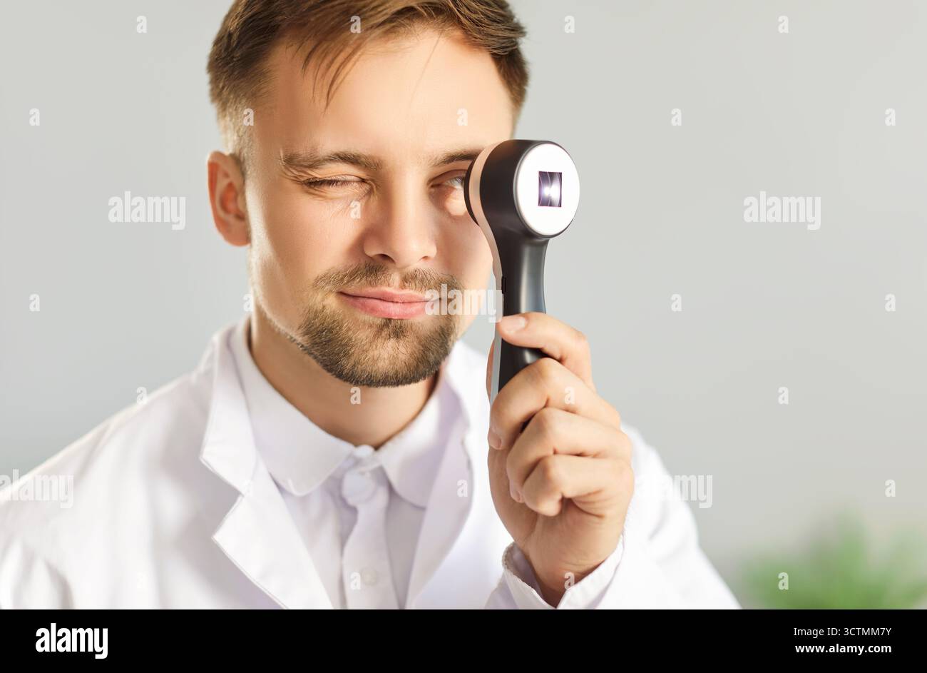 Young dermatologist looking dermatoscope hi-res stock photography and ...